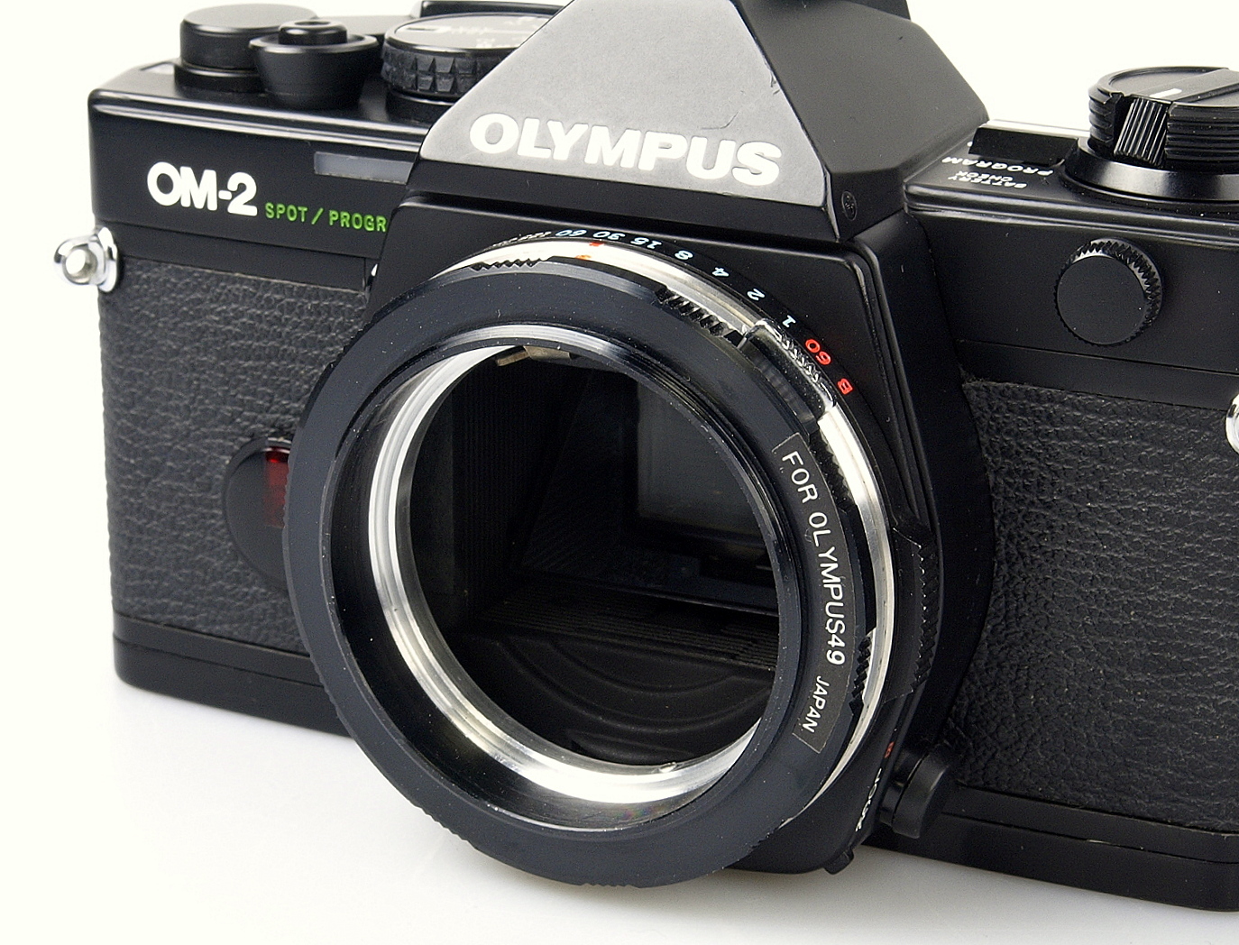 Reverse adapter from Olympus OM-system to 49mm. Tu use a standard lens ...