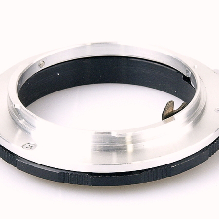 Reverse adapter from Olympus OM-system to 49mm. Tu use a standard lens ...